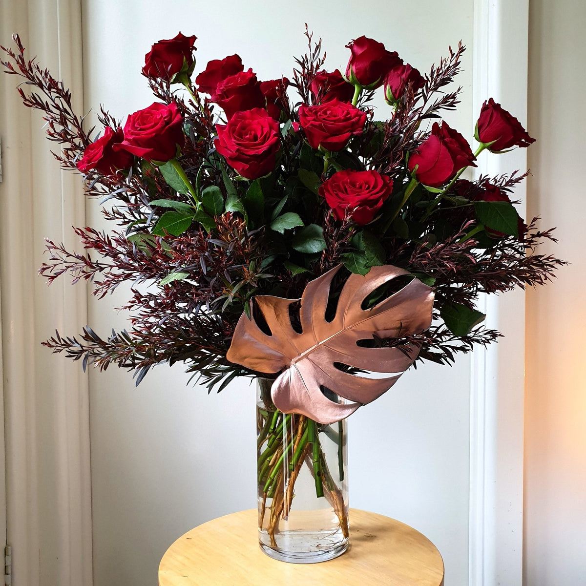 FLIRT - A vase arrangement of premium red roses, with a unique twist!